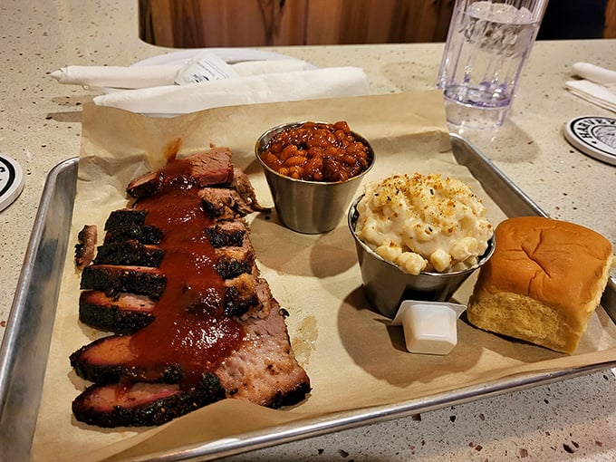 Brisket, beans, and mac & cheese – the holy trinity of comfort. That smoke ring is like nature's way of saying "you're welcome."