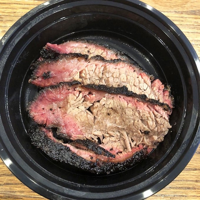 Brisket that doesn't just speak of patience but practically writes poetry about it – that smoke ring is the barbecue equivalent of a Pulitzer.