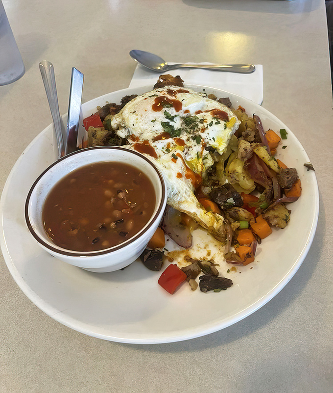 Brisket hash with eggs and beans—the breakfast equivalent of finding front-row concert tickets in your old jacket pocket.