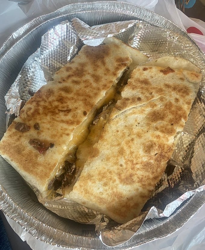 Cheese pulls for days! This quesadilla doesn't just satisfy hunger—it creates memories with perfectly browned tortillas hugging a treasure of meat and melted cheese.