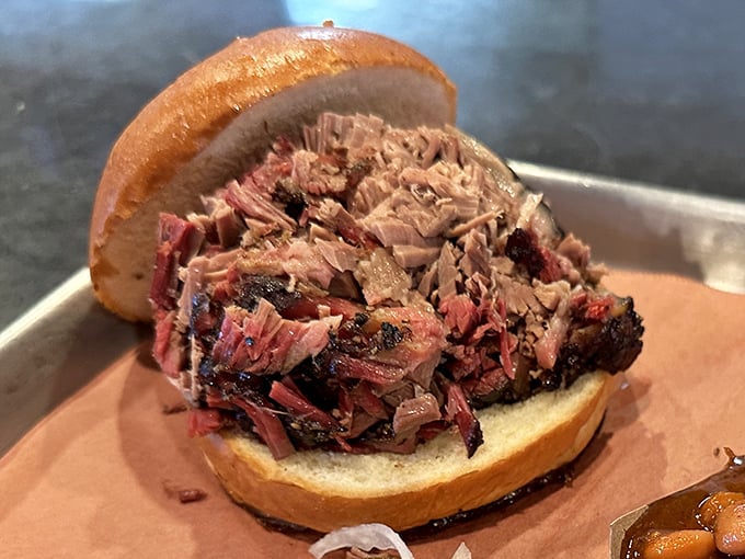 Brisket with that perfect bark and pink smoke ring – the kind that makes Texans nod in silent, respectful approval.