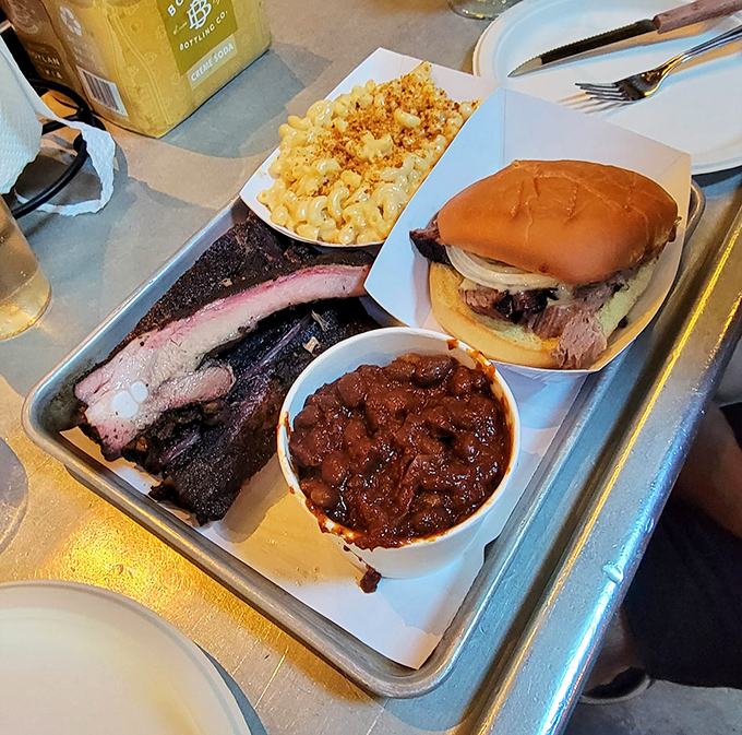 The holy trinity of barbecue bliss: brisket sandwich, burnt ends, and mac and cheese. Your diet called—it's taking the day off.