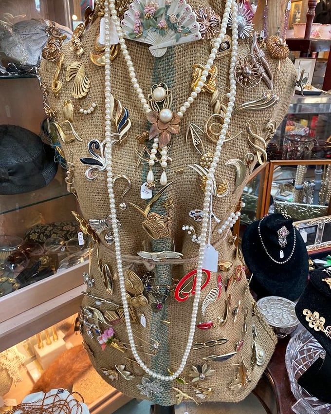 A burlap bust draped in vintage jewelry tells stories of elegant soirées and special occasions from decades past. Each piece waiting for its second act.
