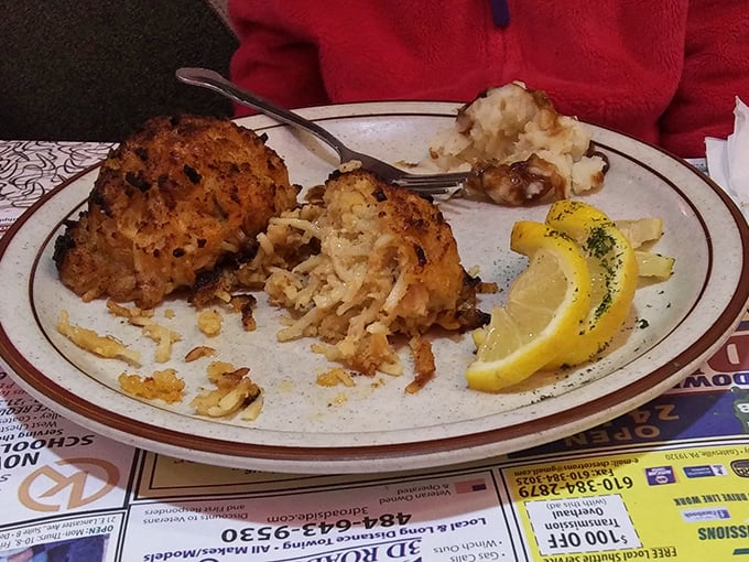 Crab cakes that look like they're auditioning for a seafood calendar—bronzed, plump, and ready for their close-up with those lemon wedges.