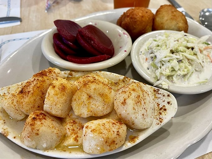 Perfectly broiled scallops dusted with paprika – proof that sometimes the simplest preparation lets truly fresh seafood speak its delicious truth.
