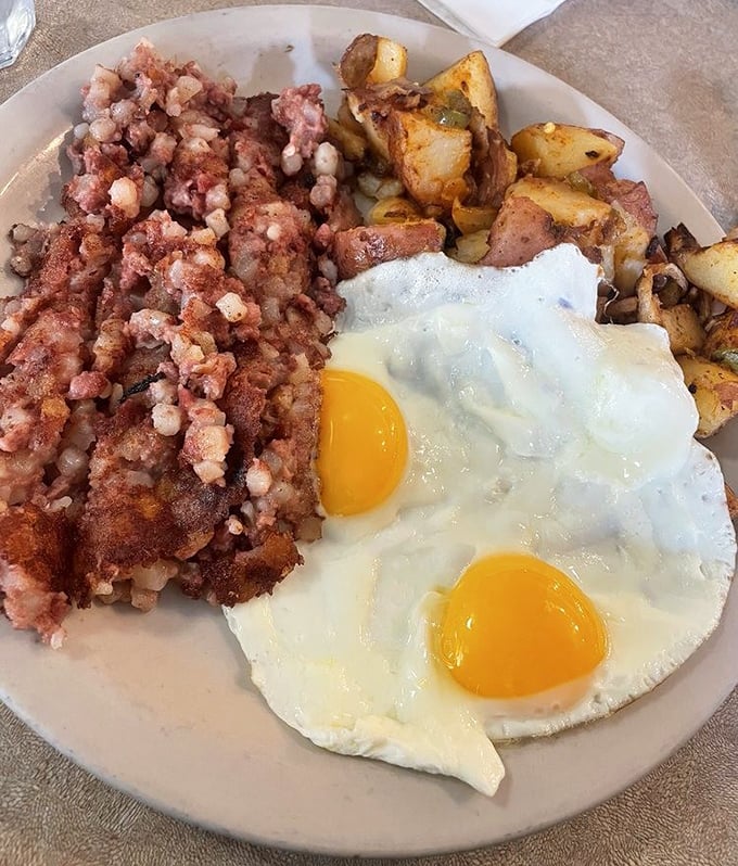Corned beef hash and sunny-side-up eggs—a breakfast combination so perfect it should have its own national holiday and retirement plan.