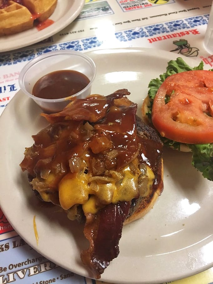 This isn't just a burger—it's a masterclass in excess. Melted cheese, bacon, and grilled onions creating a beautiful mess worth every napkin.