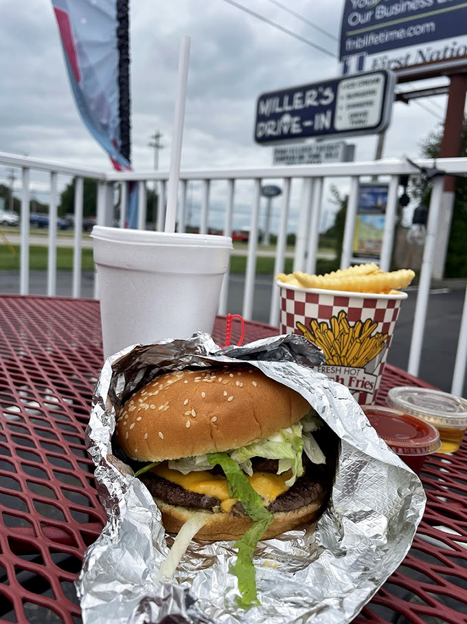 This isn't just a burger—it's edible architecture, where each layer from the melted cheese to the fresh lettuce plays its essential role in the symphony of satisfaction.