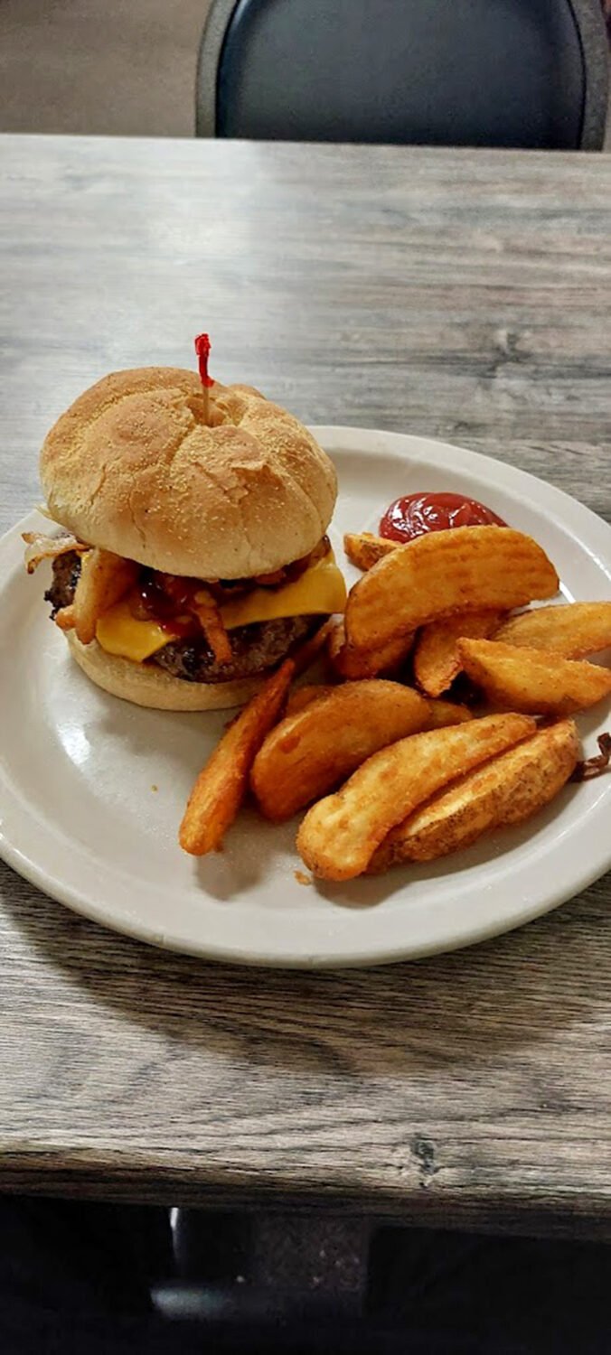 This isn't just a burger – it's edible architecture. The golden-brown bun, melty cheese, and perfectly cooked patty form a holy trinity of satisfaction.