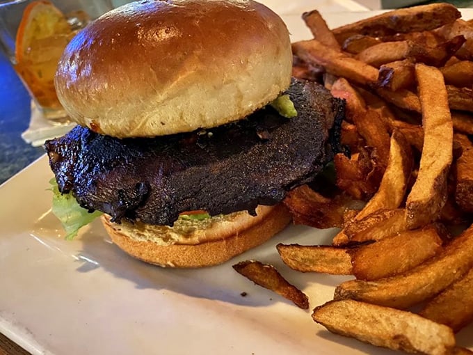 This isn't just a burger; it's a masterclass in simplicity – perfectly charred, nestled on a pillowy bun with hand-cut fries that deserve their own fan club.