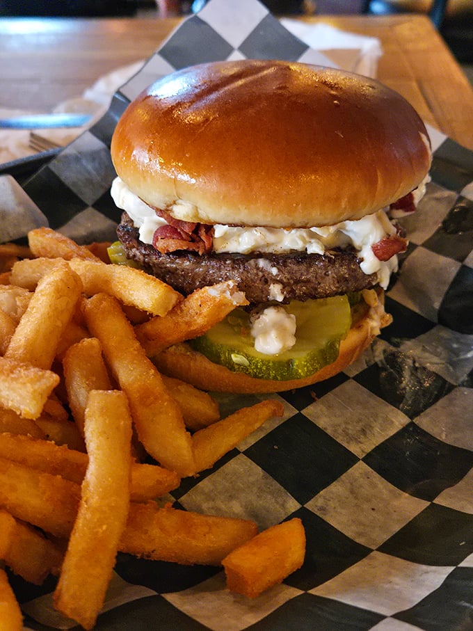 A burger that demands to be photographed before eaten. The melty cheese cascade and perfectly toasted bun suggest this isn't this patty's first rodeo.