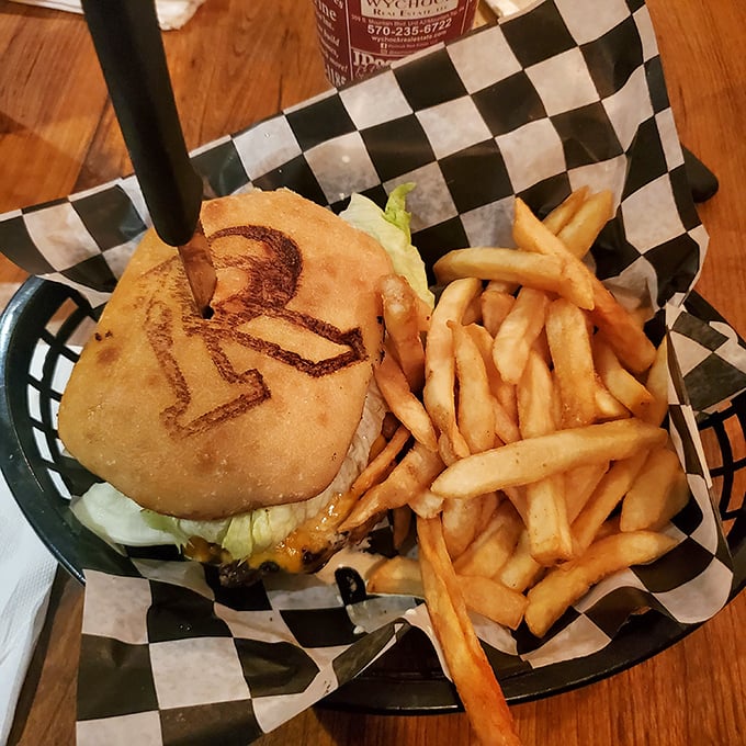 The "R" logo branded right onto the bun tells you this isn't just any burger—it's a statement piece that happens to be delicious.