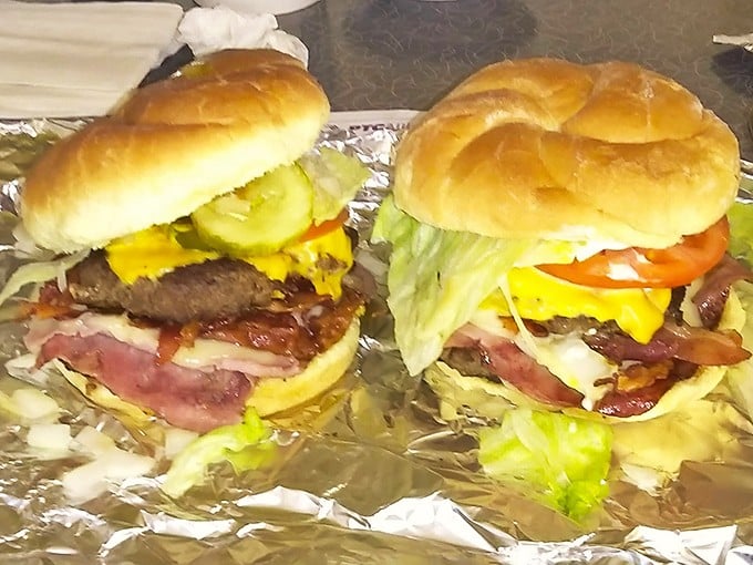 Architectural marvels of beef, bacon, and cheese that require strategic planning before the first bite. These burgers don't just satisfy hunger—they create food memories.