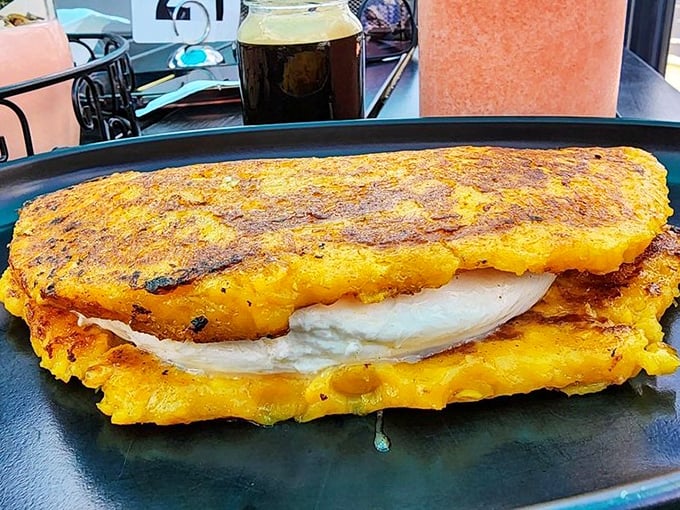 The cachapa's golden exterior gives way to a melty cheese center—like a Venezuelan version of grilled cheese that makes American singles hang their heads in shame.