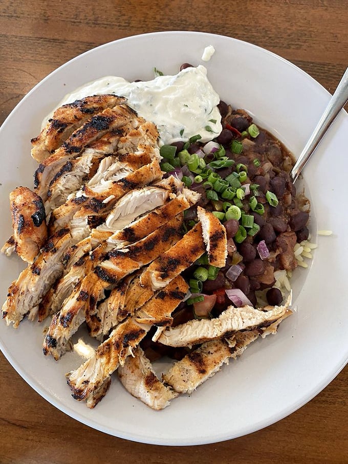 Blackened chicken perfection meets hearty black beans. This plate doesn't just satisfy hunger—it launches a flavor fiesta in your mouth.