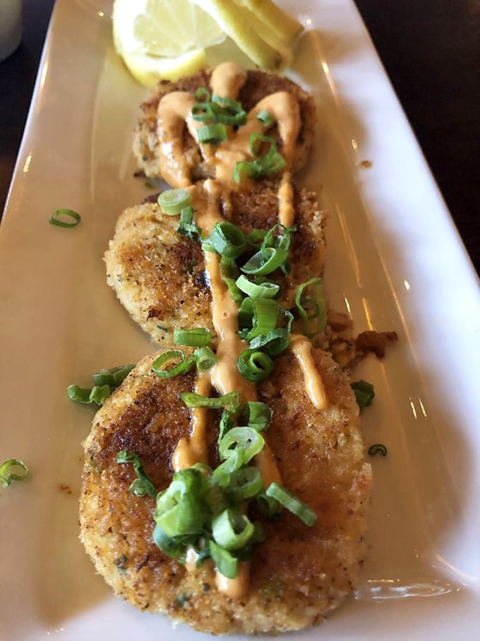 These crab cakes don't need fancy plating to impress. Golden-brown perfection with just enough sauce to complement, not overwhelm – the seafood equivalent of a perfect handshake.