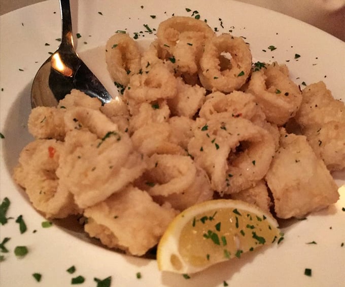 Calamari that defies the rubbery reputation of lesser versions – delicately fried, tender rings sprinkled with fresh herbs and waiting for a squeeze of lemon.