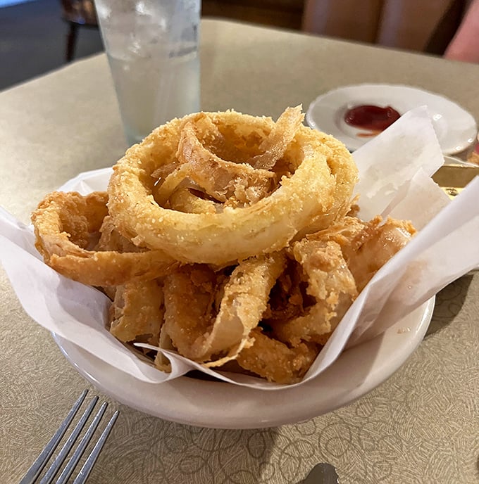 These onion rings aren't just appetizers—they're golden halos of crispy perfection. Forget sharing, you'll want these all to yourself.