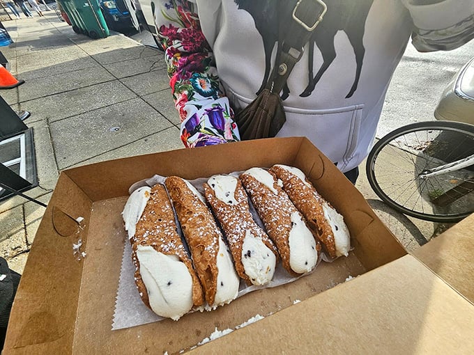 These freshly-filled cannoli aren't just desserts—they're time machines to your Italian grandmother's kitchen, even if you never had one.
