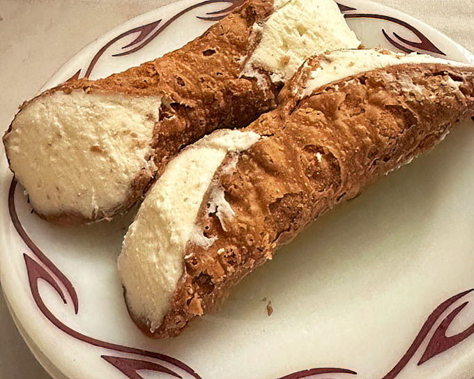 Cannolis with the perfect shell-to-filling ratio—crisp exterior giving way to creamy sweetness. The dessert equivalent of a standing ovation.