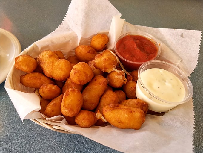 Wisconsin's unofficial state food—cheese curds—fried to golden perfection and served with dipping sauces that make you wonder why you'd eat anything else.
