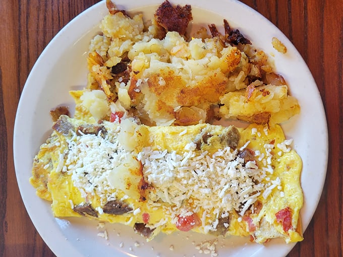 This cheese omelet with home fries isn't just breakfast—it's edible therapy, with each bite offering more comfort than your favorite childhood blanket.