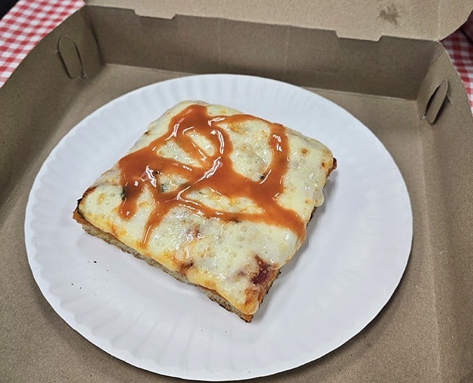 Pizza perfection in its simplest form—a slice that proves sometimes the most basic combination can deliver the most profound satisfaction.