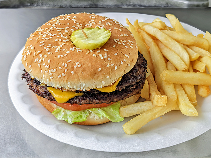 Behold the legendary Super Boy in all its glory—sesame-seeded bun, melty cheese, and beef patties with that perfect char that only comes from a well-seasoned grill.