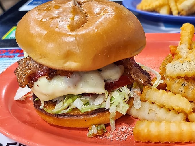 This isn't just a burger—it's architecture. Layers of bacon, cheese, and fresh veggies create a savory skyscraper that demands both hands and your full attention.