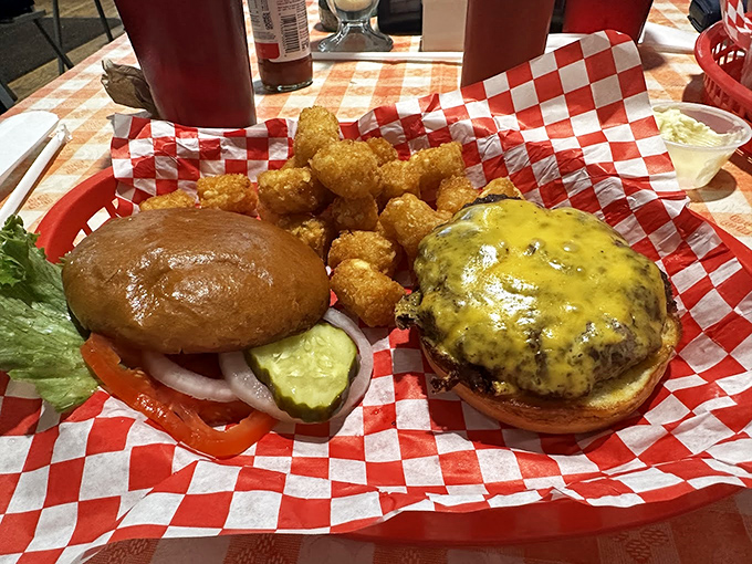 Two burgers, two approaches to happiness. One dressed simply with fresh veggies, the other smothered in melted cheese—both delivering that primal burger satisfaction we all crave.