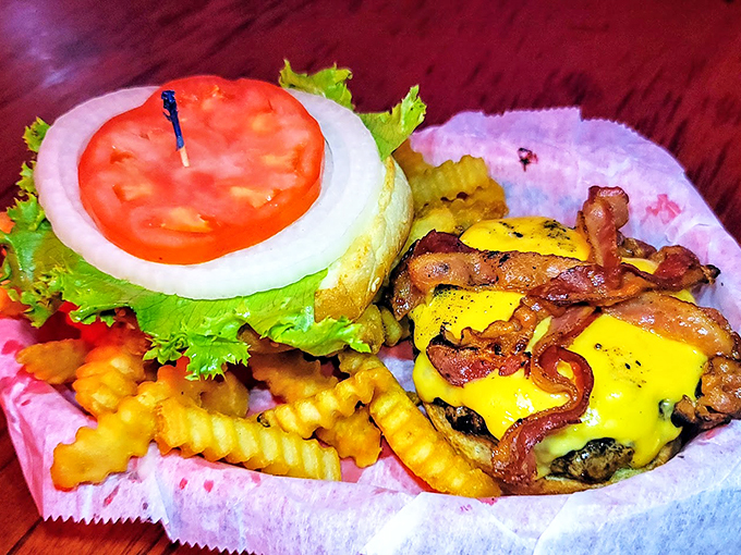 The burger that launched a thousand cravings. Melted cheese cascades over a hand-formed patty, topped with crispy bacon and served with golden crinkle-cut fries.