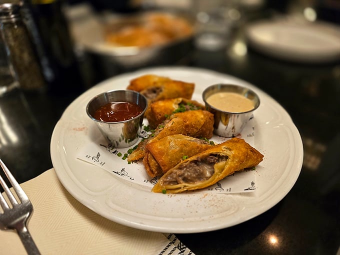 These aren't your average egg rolls—they're cheesesteak's vacation photos from its trip to Asia. Crispy wrappers hiding savory treasures, served with dipping sauces for extra flavor adventure. 