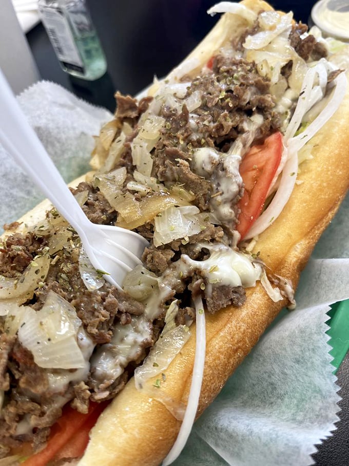 Behold the cheesesteak hoagie—where thinly sliced beef, melted cheese, and caramelized onions create the holy trinity of sandwich perfection.