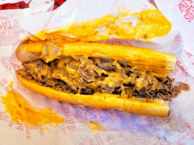 Behold the golden cascade of Cheez Whiz embracing chopped ribeye—a sandwich so iconic it should have its own Pennsylvania driver's license.