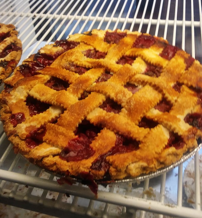 That lattice crust isn't just showing off—it's a golden-brown window into a world where cherries have found their highest calling.