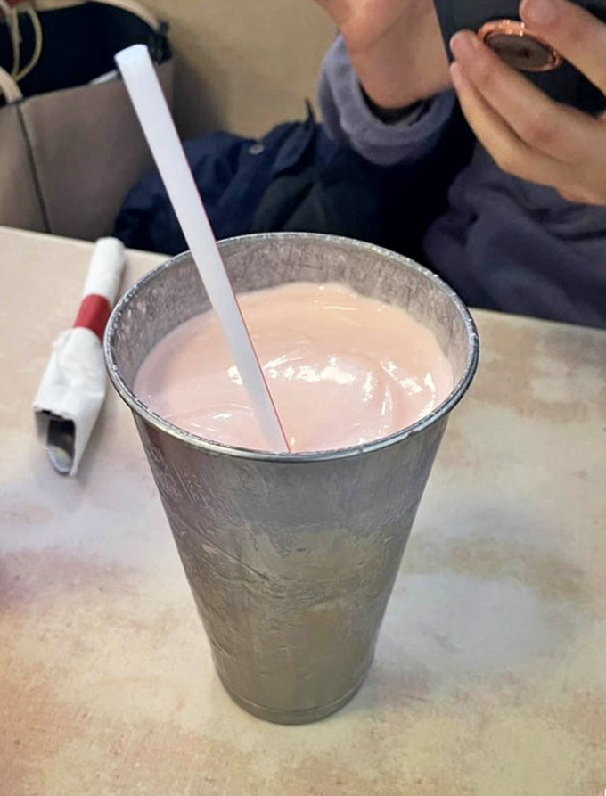 The milkshakes come in these metal mixing cups—like getting a bonus shake with your shake. It's the gift that keeps on giving.
