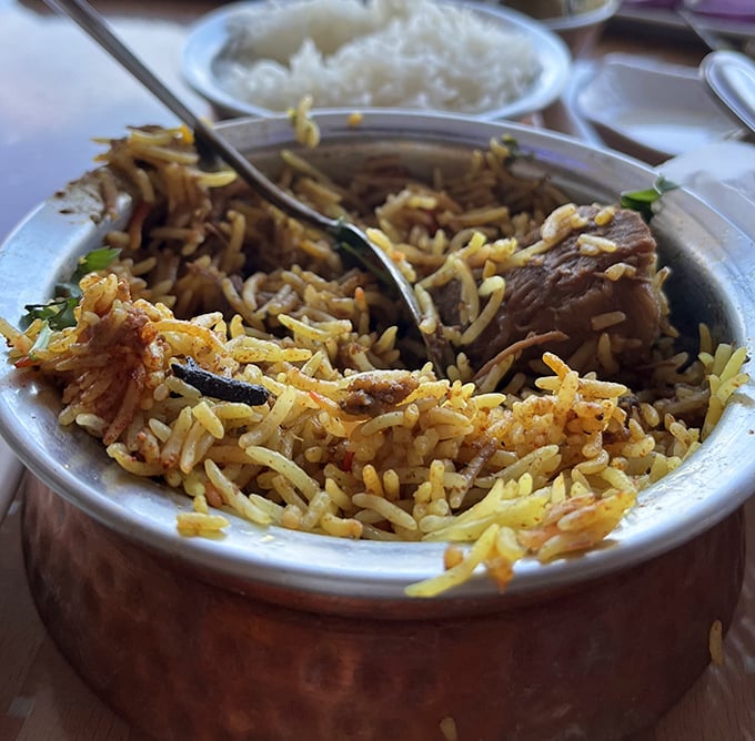 Biryani that speaks volumes – fragrant rice interlaced with tender meat and warming spices, a dish that whispers stories of distant bazaars.