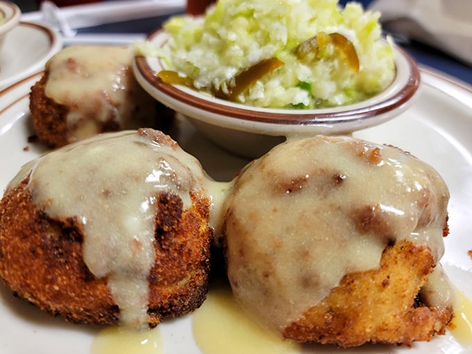 Chicken croquettes under a waterfall of gravy – crispy on the outside, creamy within, and enough to make you consider moving to Quarryville permanently.