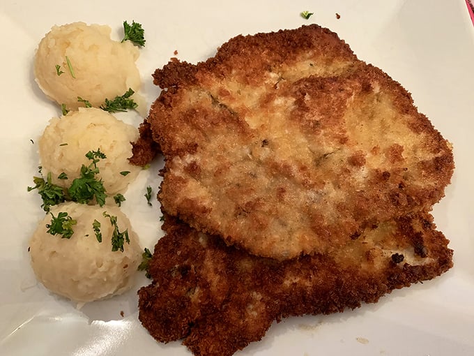 This golden-brown kotlet schabowy isn't just a chicken cutlet – it's a masterclass in crispy perfection with pillowy mashed potatoes standing guard. 
