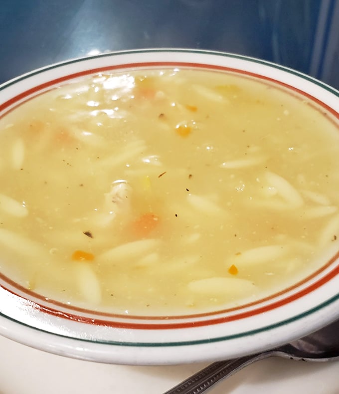 The chicken lemon soup – avgolemono to those in the know – offers a silky, citrusy embrace that somehow feels like both comfort food and culinary sophistication.