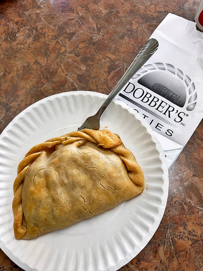 Perfection on a paper plate—the crimped edge of this pasty is the artisanal signature of a true Michigan classic.