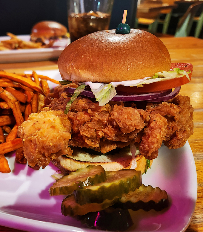 This Nashville Hot Chicken Sandwich isn't just food—it's an event. Towering, crispy, and demanding both hands and several napkins for proper enjoyment.