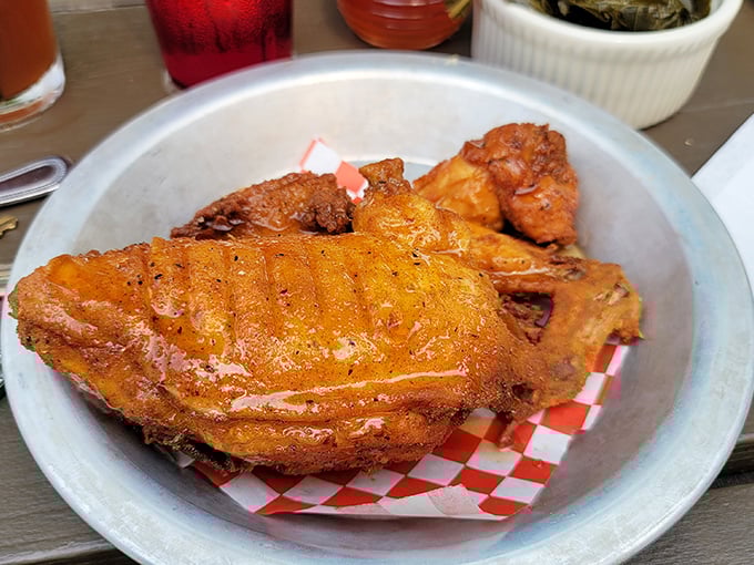 Fried chicken that's worth crossing state lines for—crispy, golden-brown, and drizzled with honey that catches the light like liquid amber.