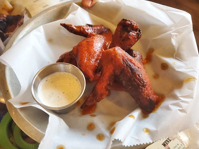 These wings aren't messing around – gloriously lacquered with sauce and accompanied by a dip that's asking you to make some important life decisions.