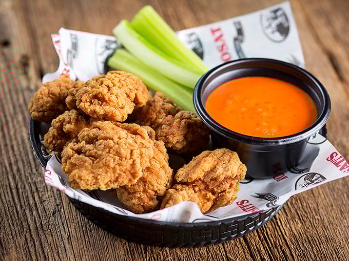 Golden-fried chicken wings that crunch like autumn leaves, paired with buffalo sauce that brings just enough heat to make you reach for your beer.
