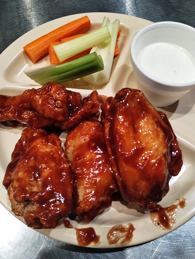 Chicken wings that look like they've been dipped in barbecue heaven – glistening with sauce and begging to be devoured.