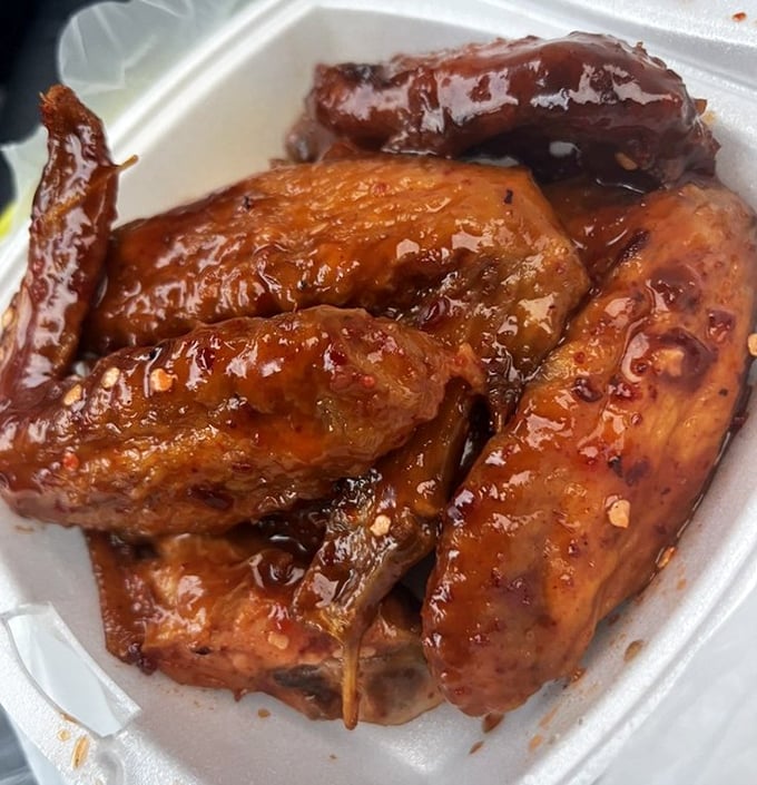 These aren't just wings; they're glistening ambassadors of joy. The sauce—sweet, spicy, and clinging to every morsel—might require a moment of silence.