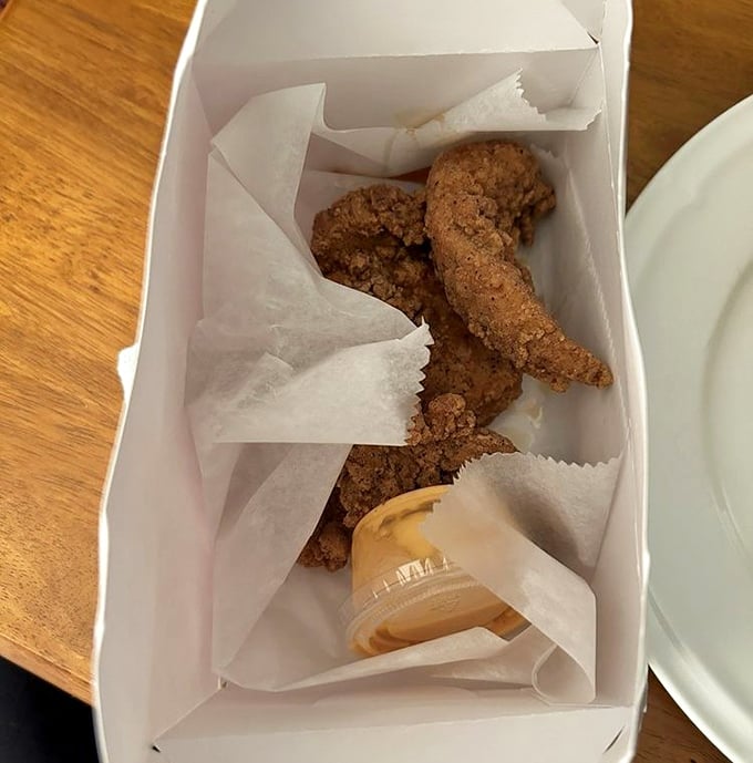 Chicken tenders that actually taste like chicken – what a concept! Crispy, craggly coating protecting juicy meat within, like edible Fort Knox.