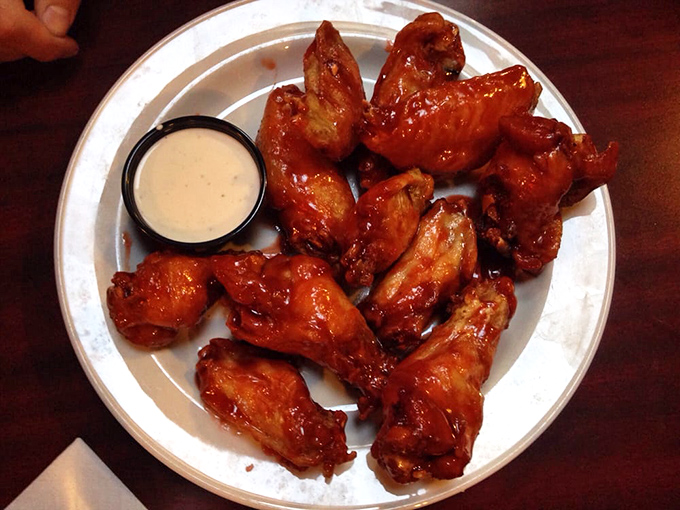 Wings so perfectly glazed they belong in a museum—if museums allowed enthusiastic finger-licking and occasional moans of appreciation.