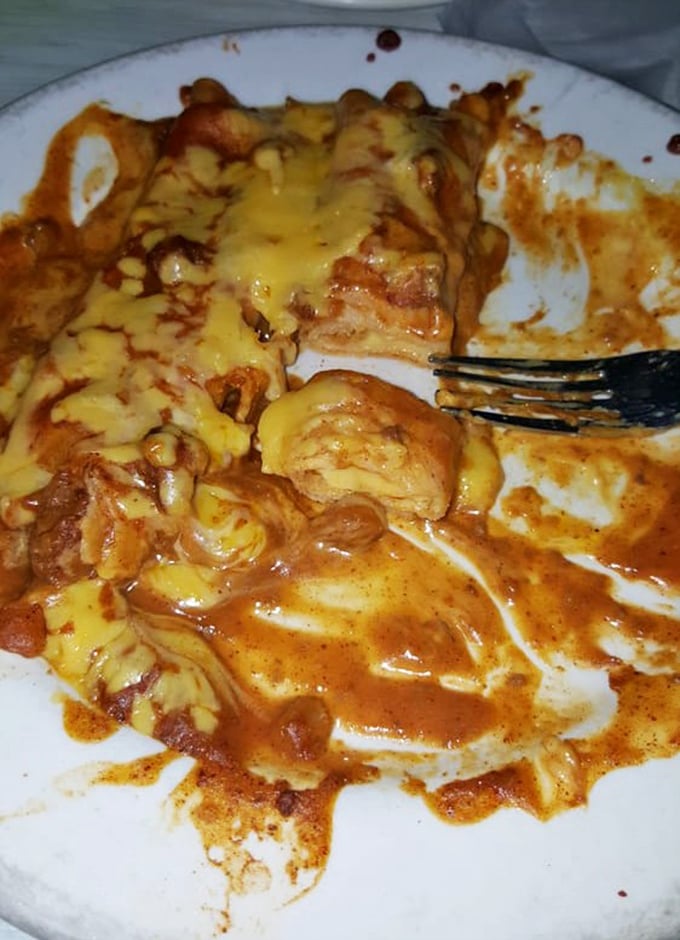 This isn't just melted cheese—it's an edible history lesson. The chile con carne sauce blankets these enchiladas like a warm Texas hug.